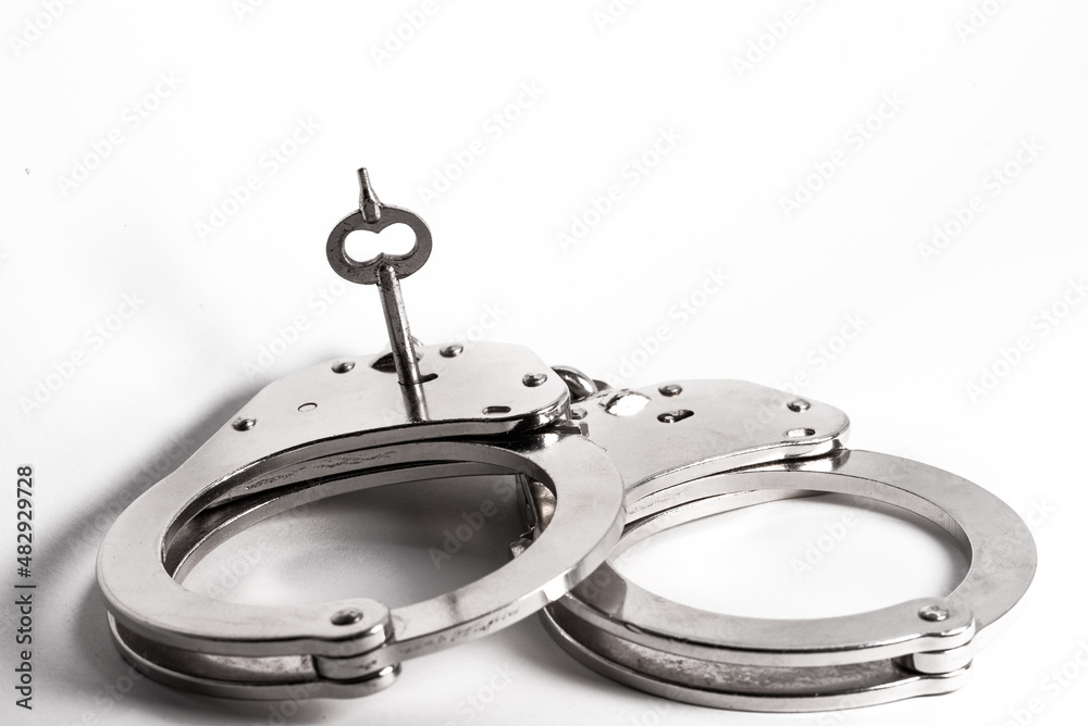 Police handcuffs. Equipment for police officers. Opening handcuffs with ...