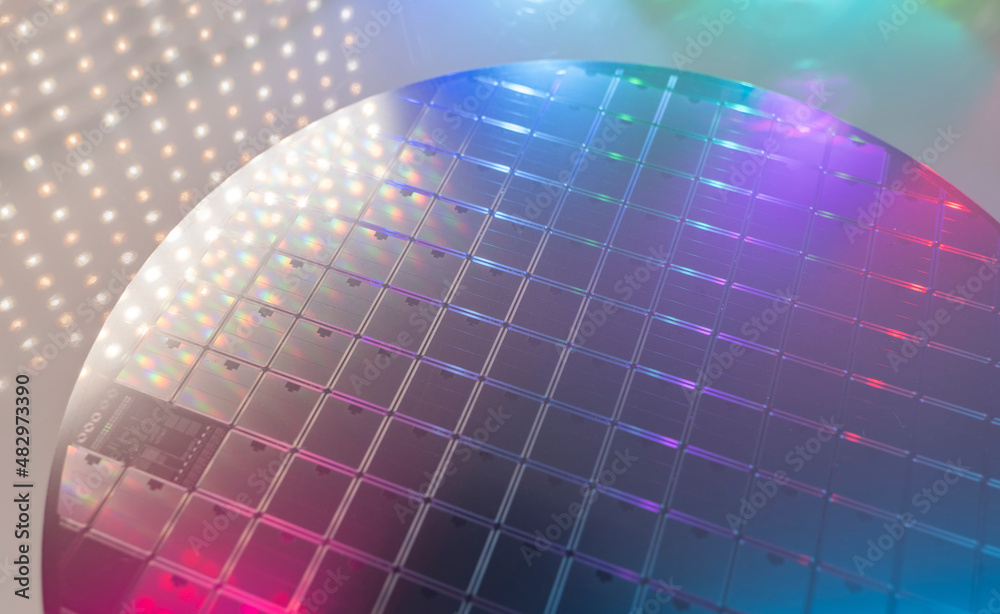 surface of Silicon Wafers and Microcircuits reflecting different colors ...