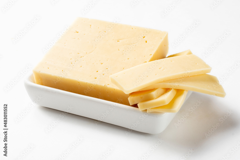 Russian cheese slicing on a white background for insulation. Classic ...