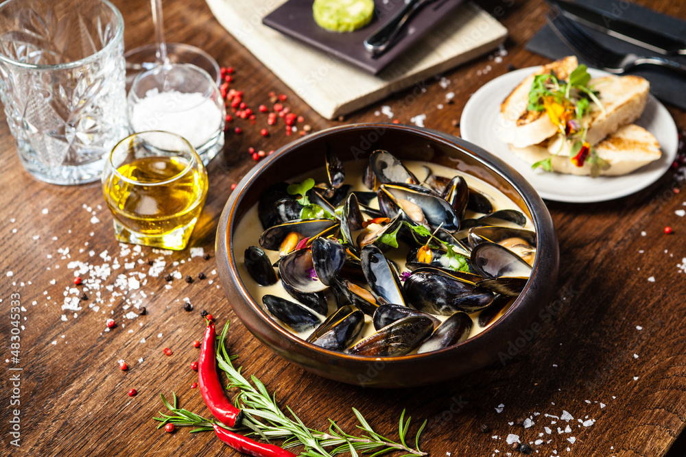 Blue mussels in cream wine sauce. Delicious healthy Italian traditional ...