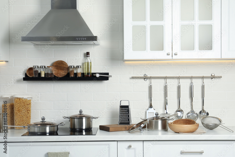 Countertop with different cooking utensils in kitchen Stock Photo ...