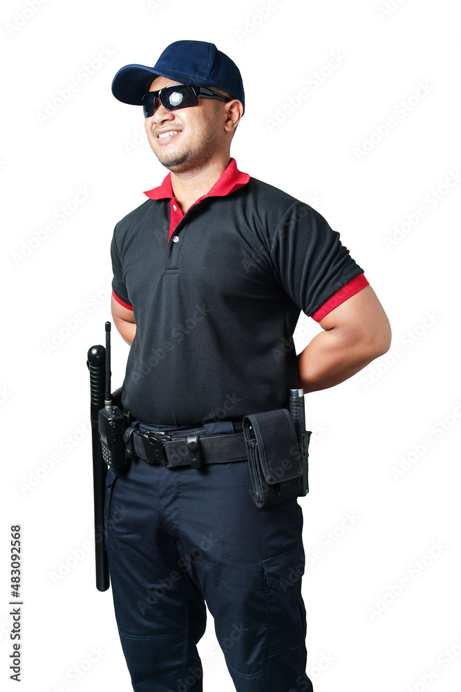 The security guard, wearing black glasses, wearing a cap, stands ready ...