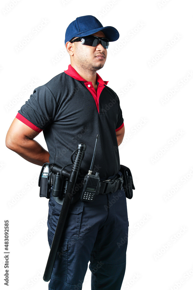 The security guard, wearing black glasses, wearing a cap, stands ready ...