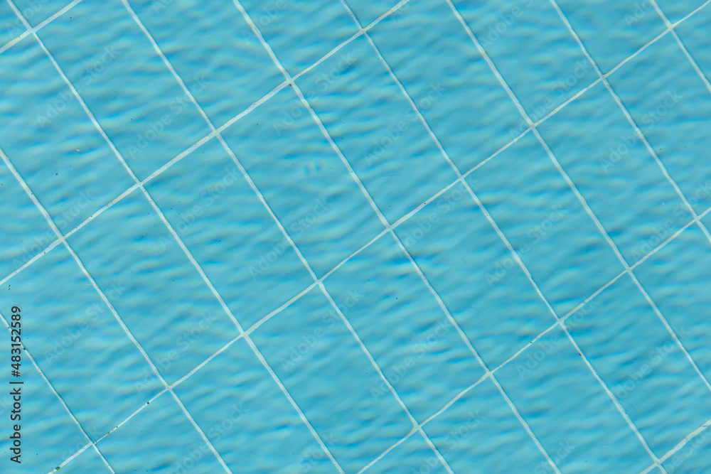 Beautiful texture of water with sun lights in a pool on the blue ...