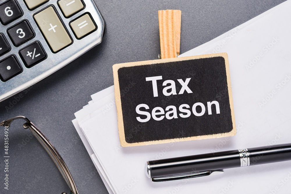 Tax Season text on wooden sign clothespin clipped at the top of the ...