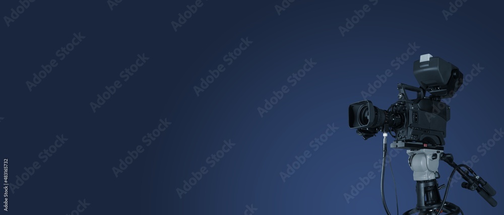 Digital film camera in the dark wall background. Video camera for film ...
