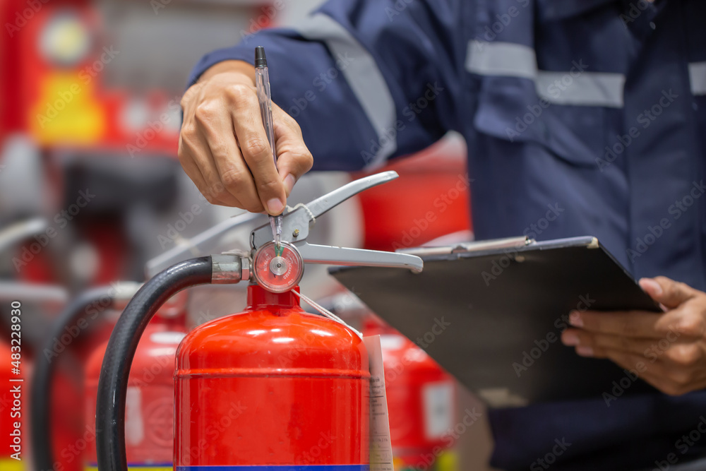 Engineer are checking and inspection a fire extinguishers tank in the ...