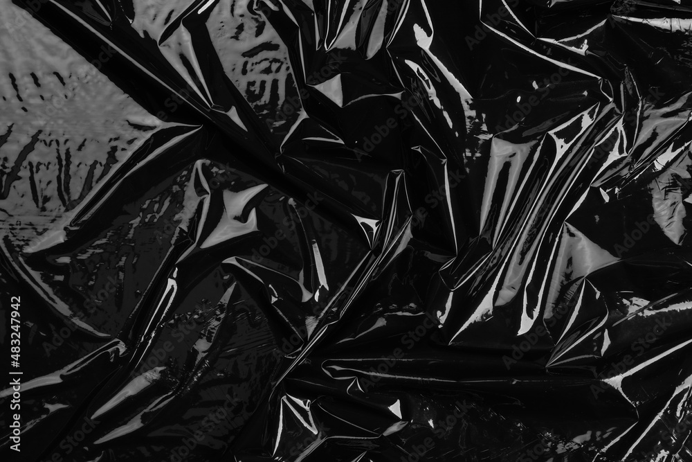 Black plastic stretch wrap film as background, top view Stock Photo ...
