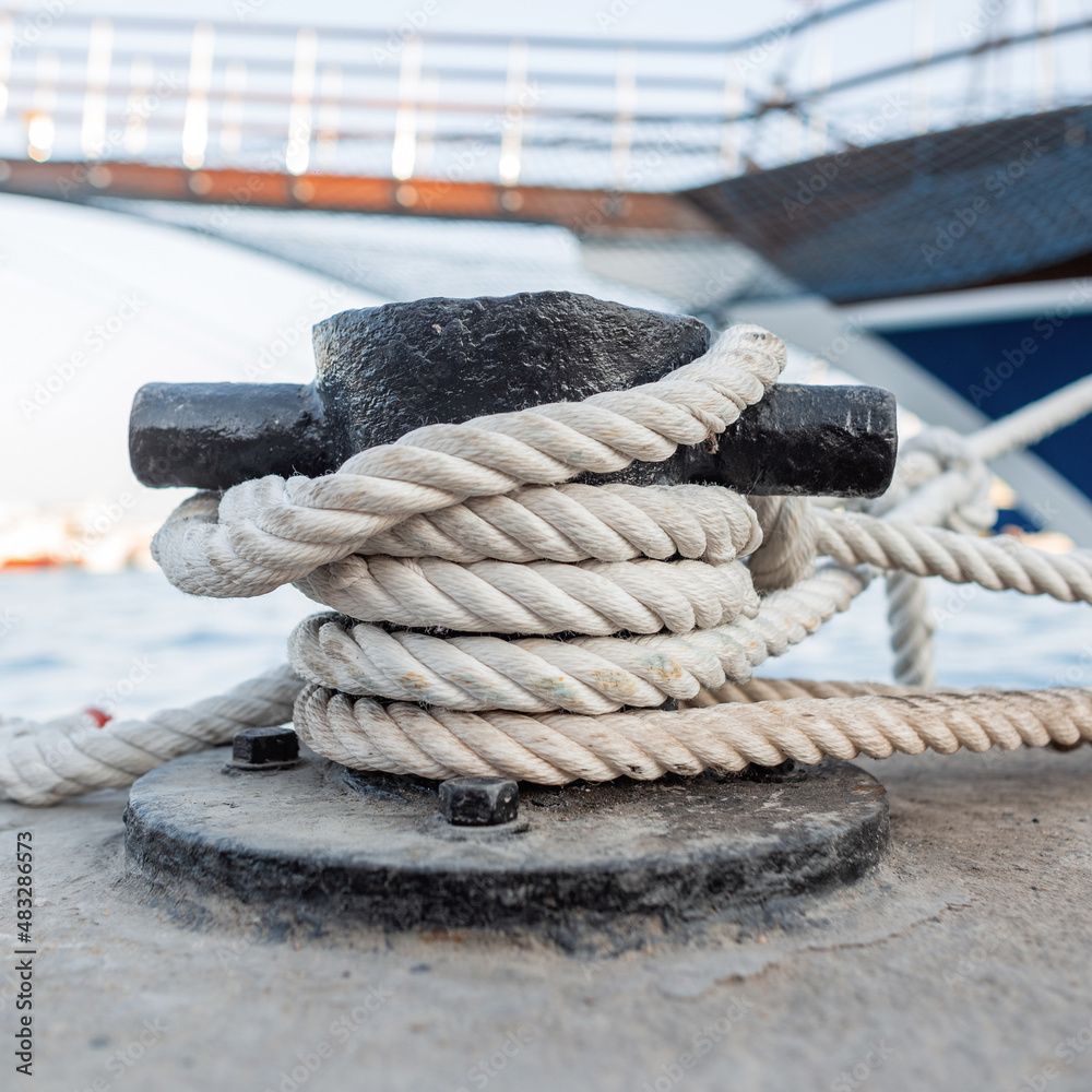 yacht is on the pier. The white rope is tied to the bollard. Anchorage ...