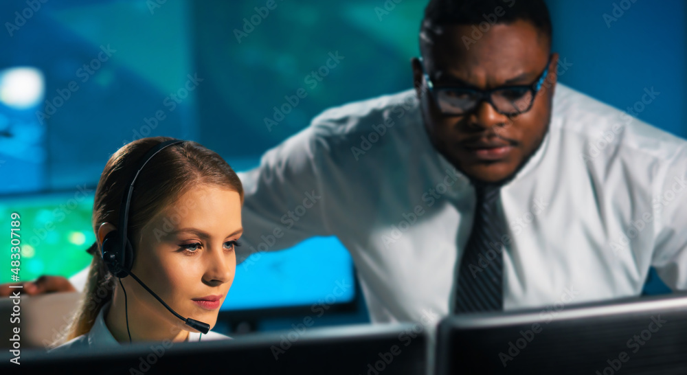 Aircraft flight control officer monitors the approach of aircraft from ...