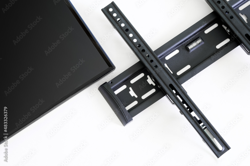 Wall metal bracket for installing a TV or monitor on a white background ...