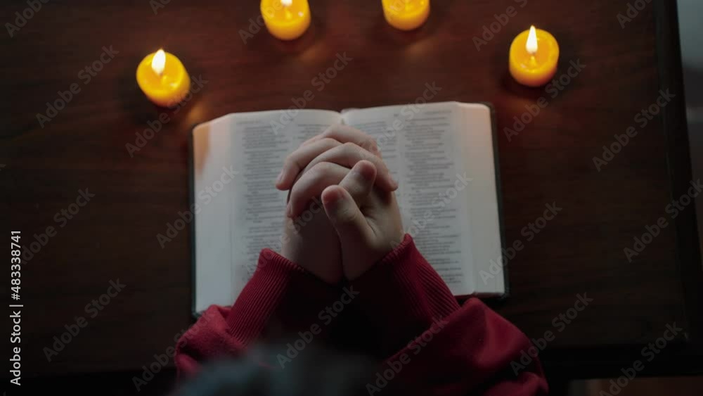 UHD 4k Slow motion B roll of young christian while praying and worship ...