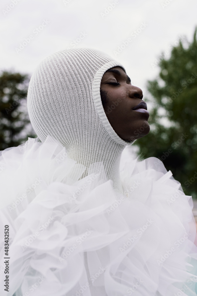 Alien. African beautiful model with perfect body in white tulle ruffles ...