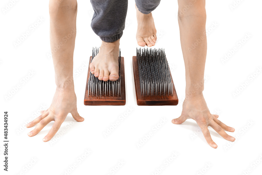 Human bare feet and supporting hands on the floor. Getting up on the ...