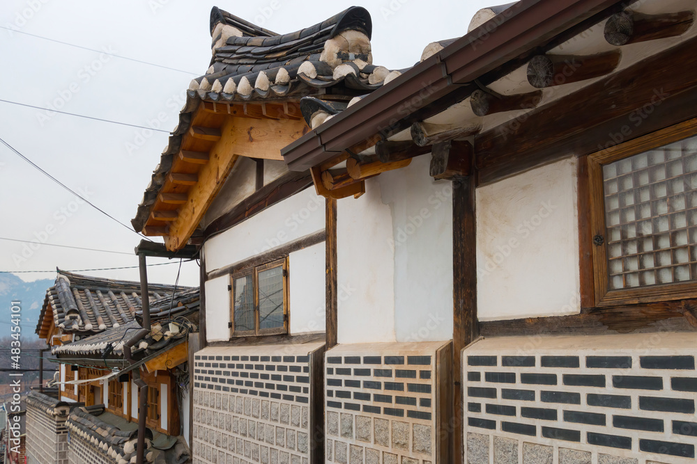 Facade with windows and roof tiles of traditional Korean residential ...