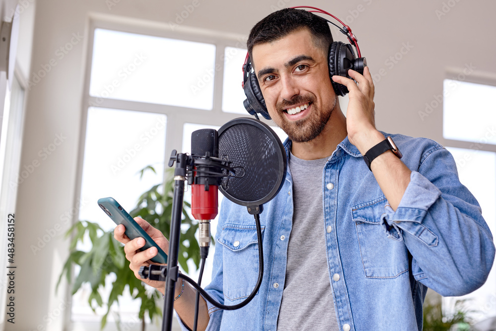 music, show business, people and voice concept.handsome smiling male ...