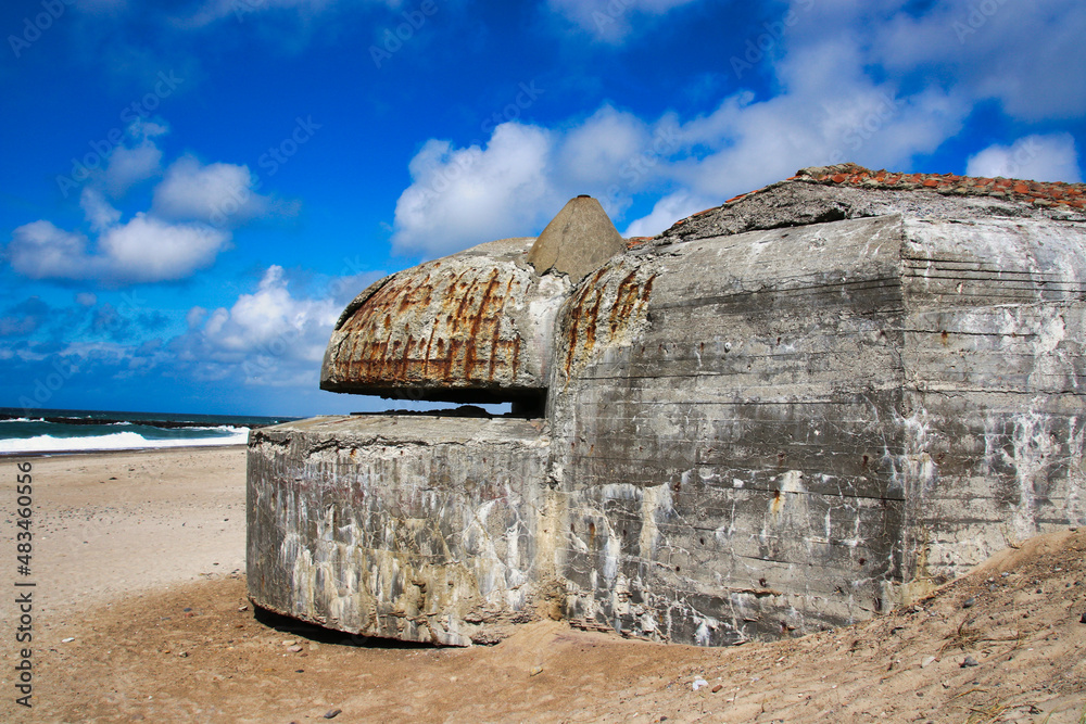 Old concrete bunkers from WWII line the beaches on the west coast of ...