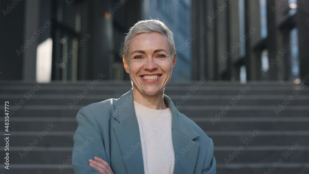 Smiling business lady with short haircut posing outdoors Stock Video ...