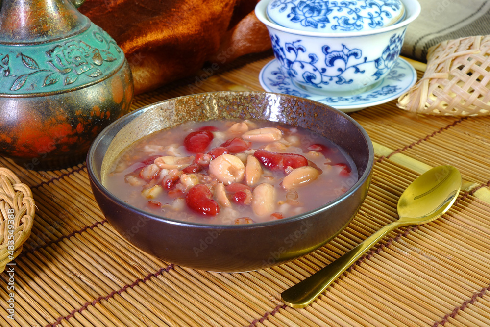 Chinese traditional mixed rice congee in glass bowl. Rice congee made ...