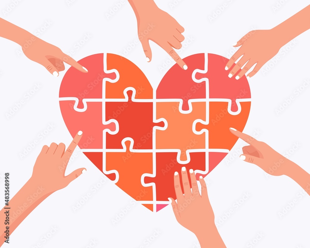 People hold big heart puzzle jigsaw symbol in hands. Charity and ...