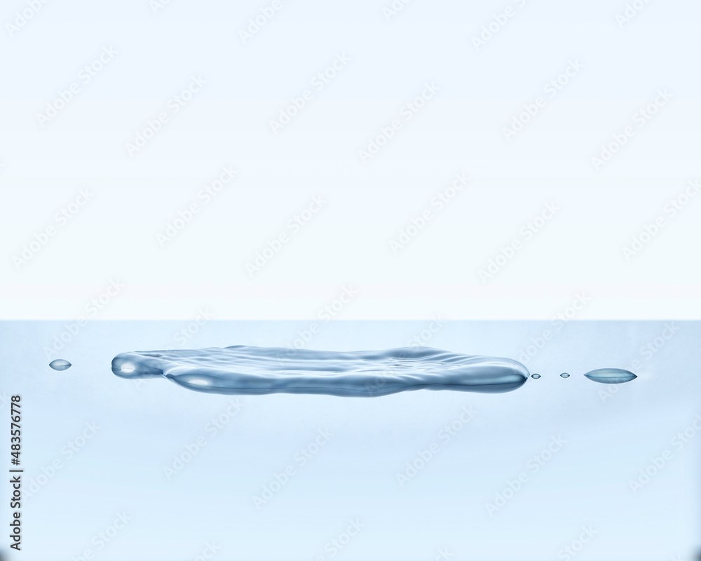 Water puddle from drops spilled onto surface. Water droplets splashed ...