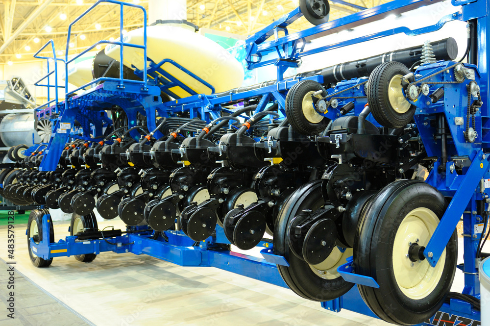 Modern trailed seeding machine placed on stand during an exhibition ...