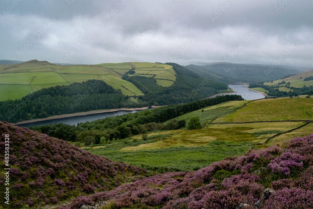 Vast landscape of Peak District hills covered with clouds and fog ...