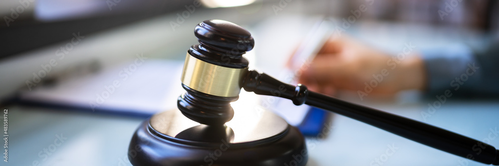 Cropped Image Of Female Judge Signing Document Stock Photo | Adobe Stock