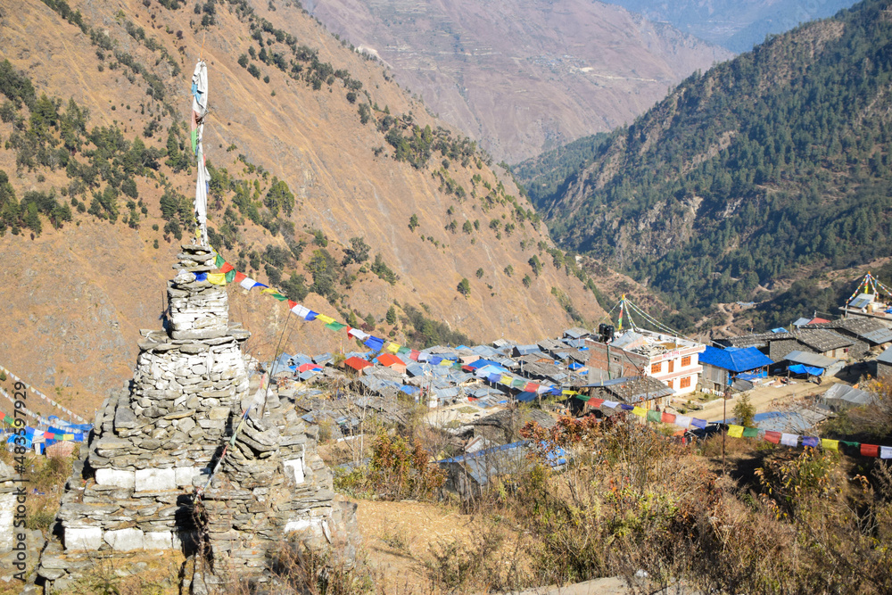 Houses of the village Gatlang in Nepal with a stupa in the foreground ...