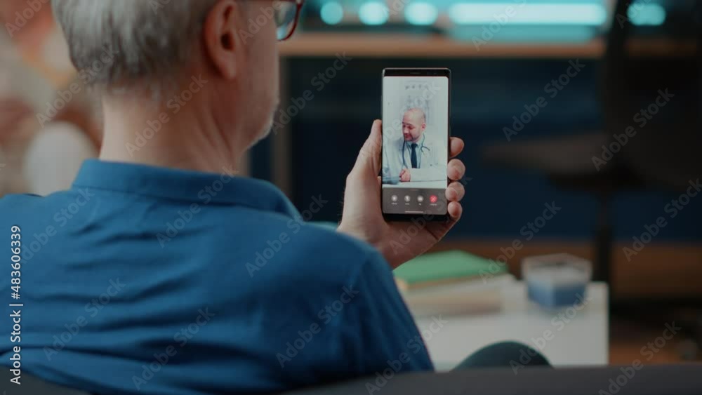 Elderly person calling doctor on videoconference to attend consultation ...