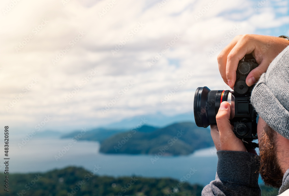 Photographer taking a photo in nature. Photography class learning ...