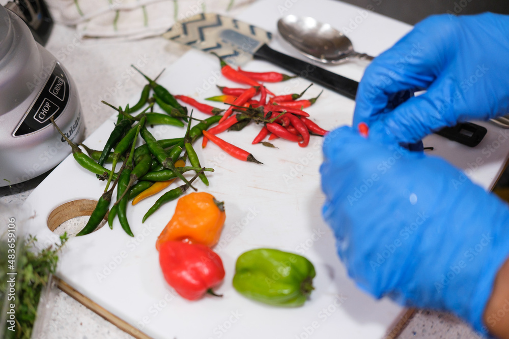 Preparation of a traditional Guyanese Christmas dish called garlic pork ...