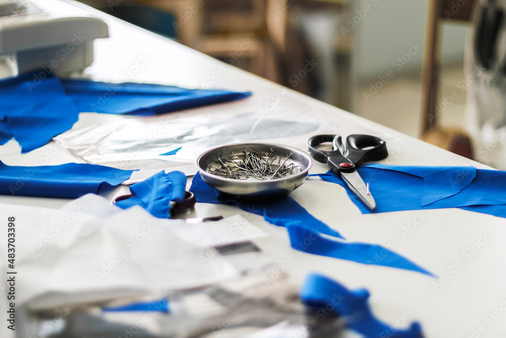 Cutting table in a sewing workshop: the workflow of cutting clothing ...