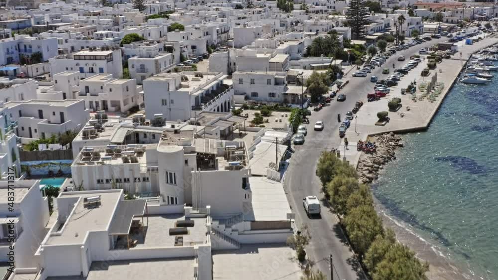 Parikia Paros Greece Aerial v3 birds eye view drone flying along the ...