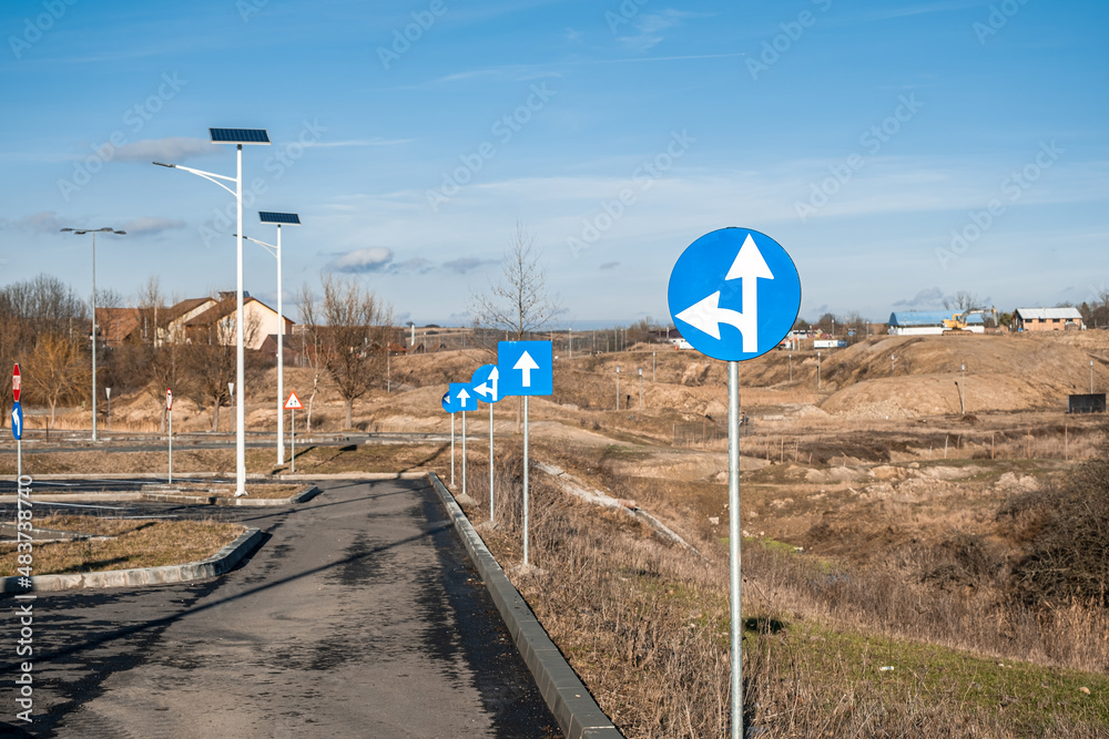 traffic signs on the side of the road Stock Photo | Adobe Stock