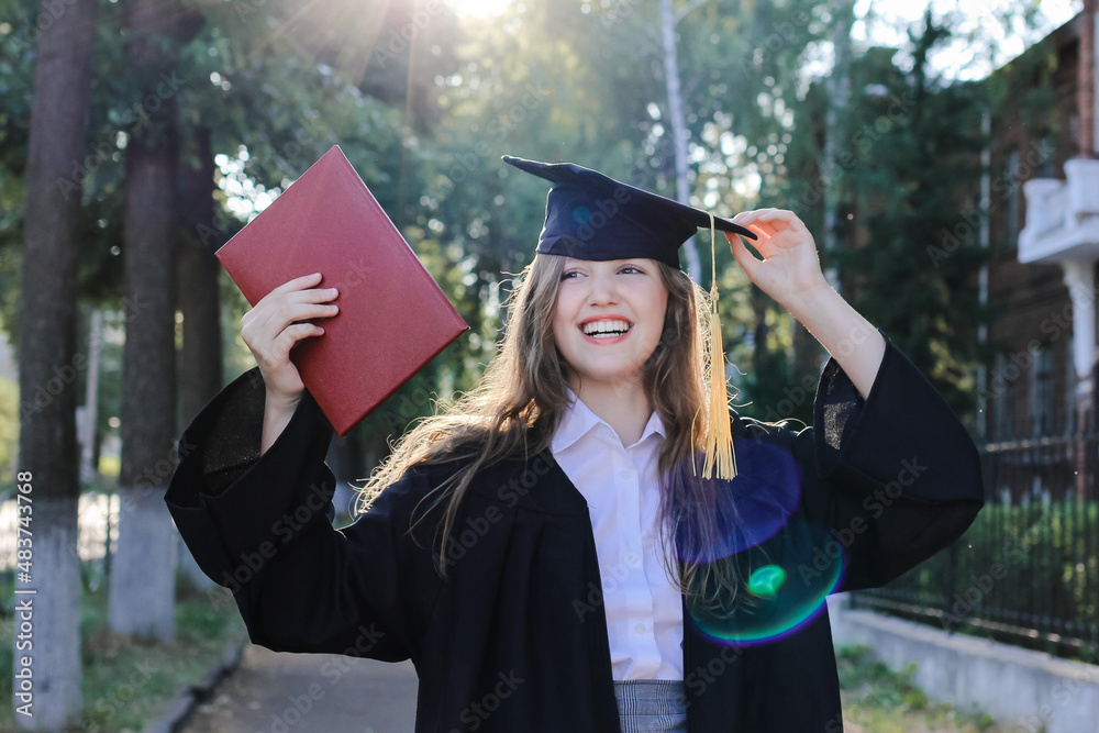 Cute teenage graduate girl laughing and having fun. No school, back to ...