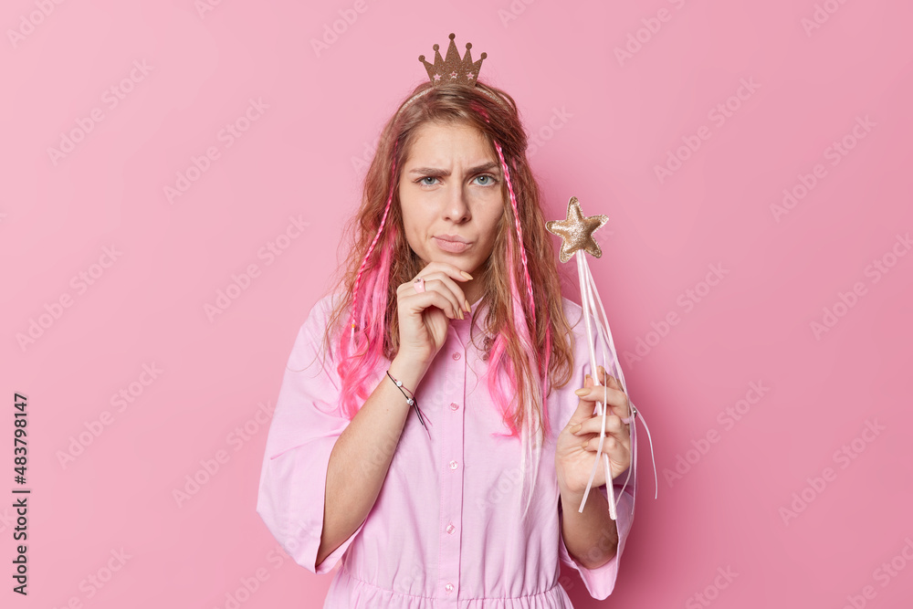 Upset discontent beautiful young woman has sulking expression raises ...