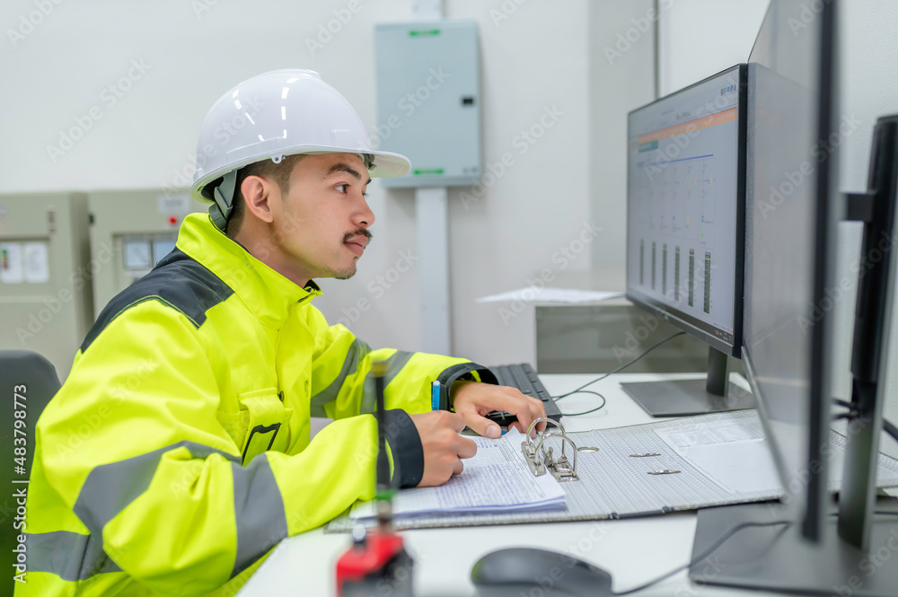 Electrical engineer man checking voltage at the Power Distribution ...