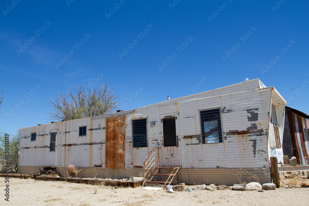 single wide mobile home trailer left in disrepair rusting steel ...
