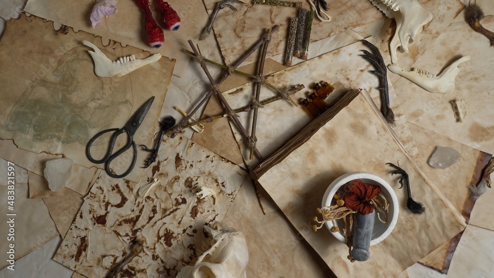 Mystic occult background with witch craft tools and ingredients on old ...