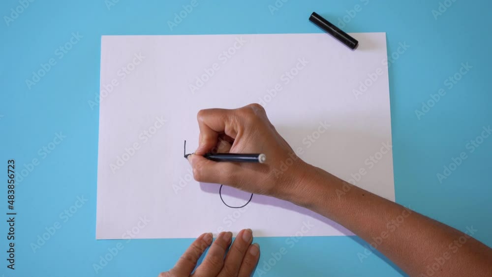 Person's Hand With Black Color Pen Drawing Shapes Making A Chart ...