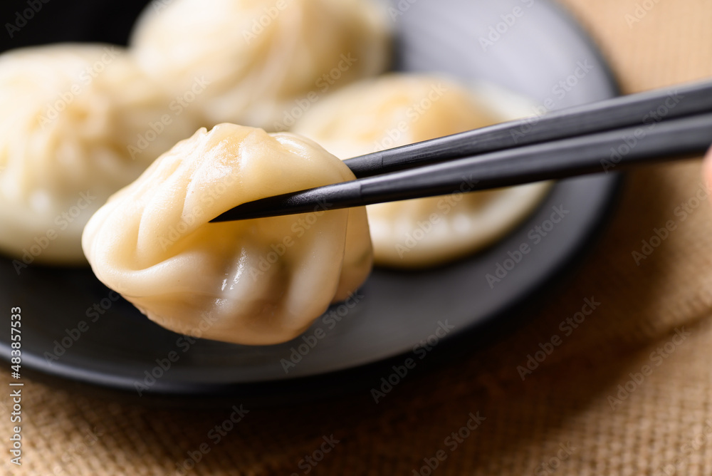 Xiao long bao, small Chinese steamed bun filling with minced pork on ...