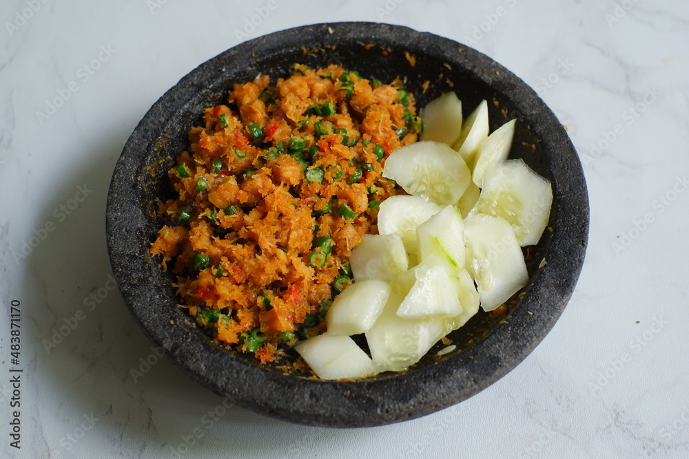 a plate of traditional food named sambal urap that made from fresh ...