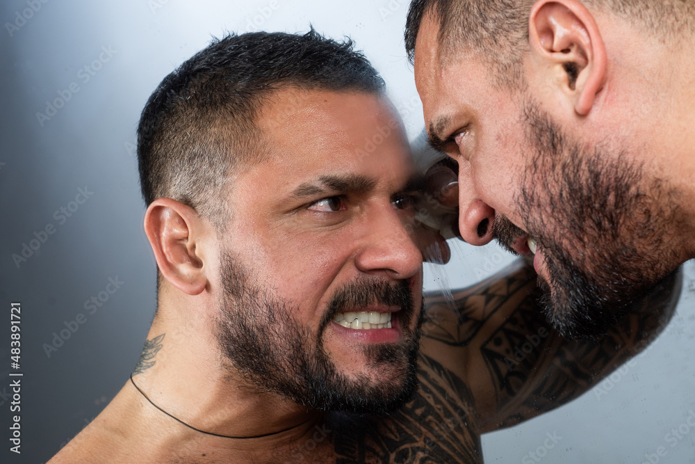 Aggressive angry man. Brutal man, serious face of handsome male model ...