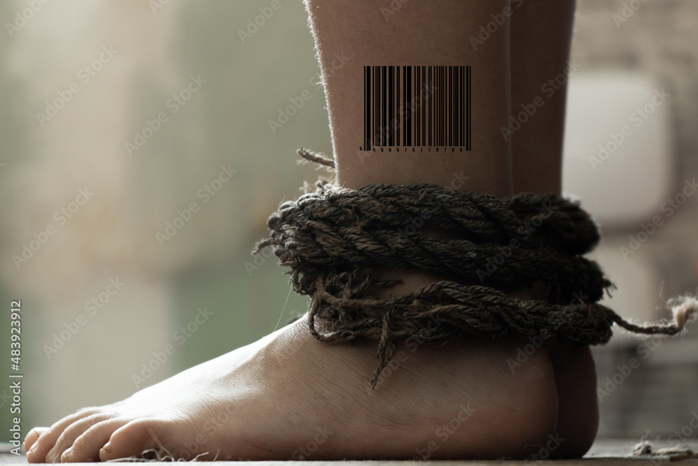 barcode on the leg of a child with a tied rope, people are slaves Stock ...