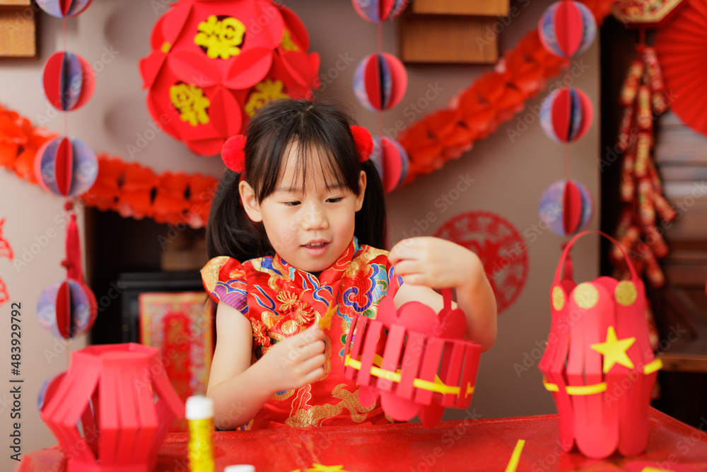 young Chinese girl making traditional Chinese "FU" means" lucky ...