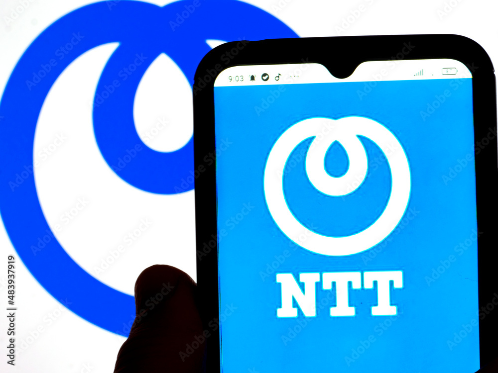 In this photo illustration, the NTT logo is displayed on a smartphone ...