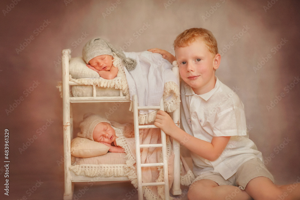 Twins. The large family. Brothers. Elder brother and younger brothers ...