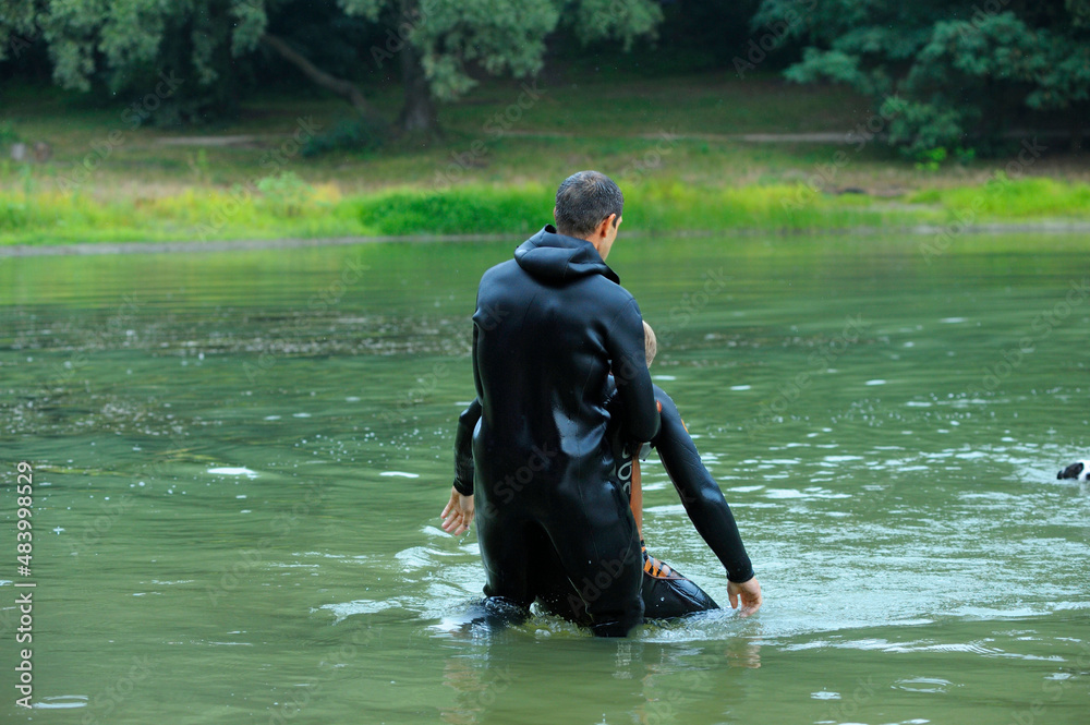 Lifeguards showing right way of pulling a drowning out from the water ...