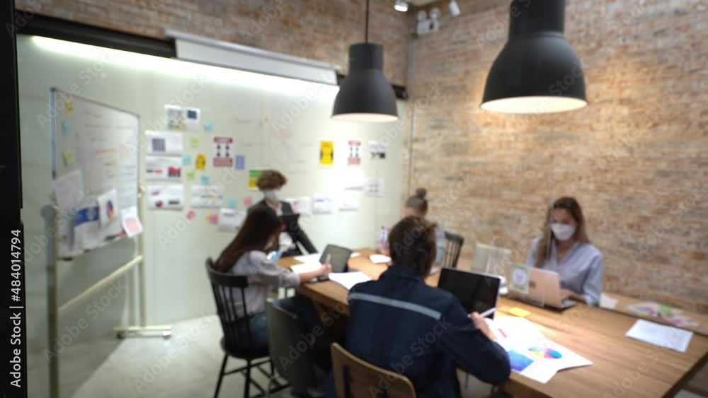 New Normal workplace with Covid-19 safety signs attached in front of an ...